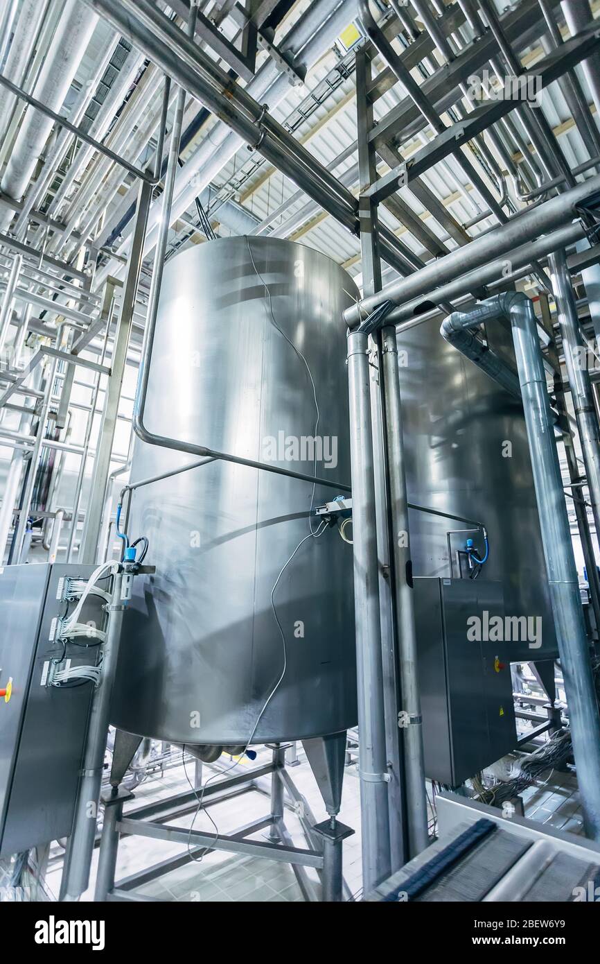 Industrial stainless steel fermentation vats in modern brewery Stock ...