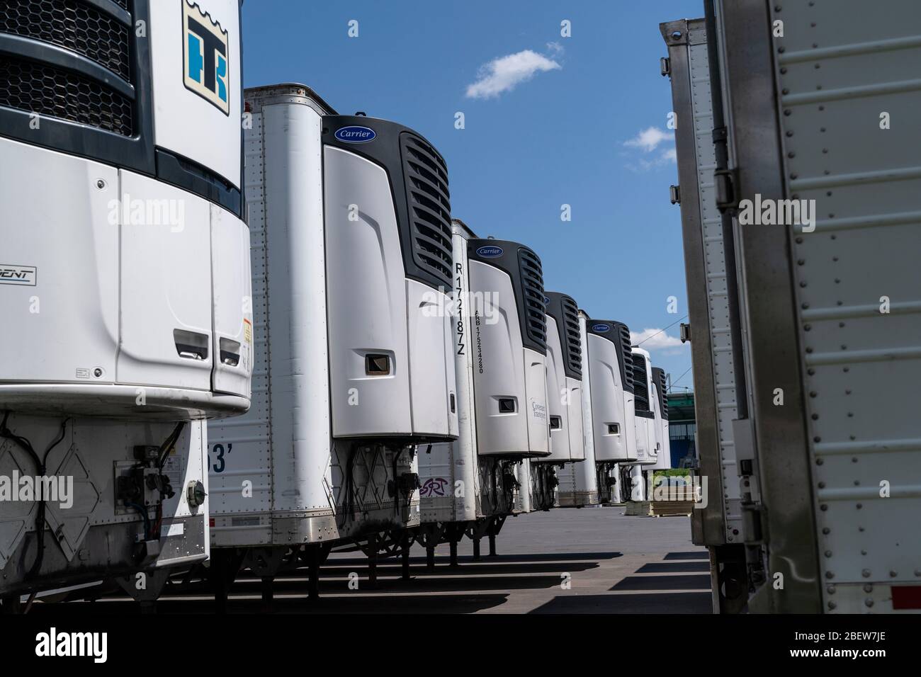 New York, NY - April 15, 2020: Dozens of refrigerated trucks and ...