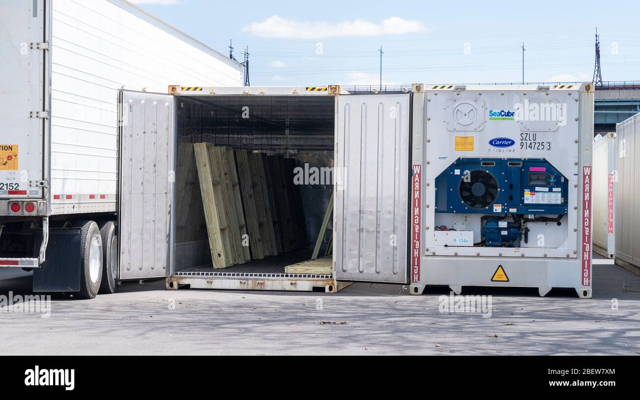 New York, NY - April 15, 2020: Dozens of refrigerated trucks and ...