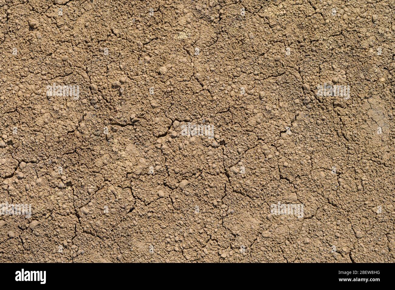 cracked clay ground background texture Stock Photo - Alamy