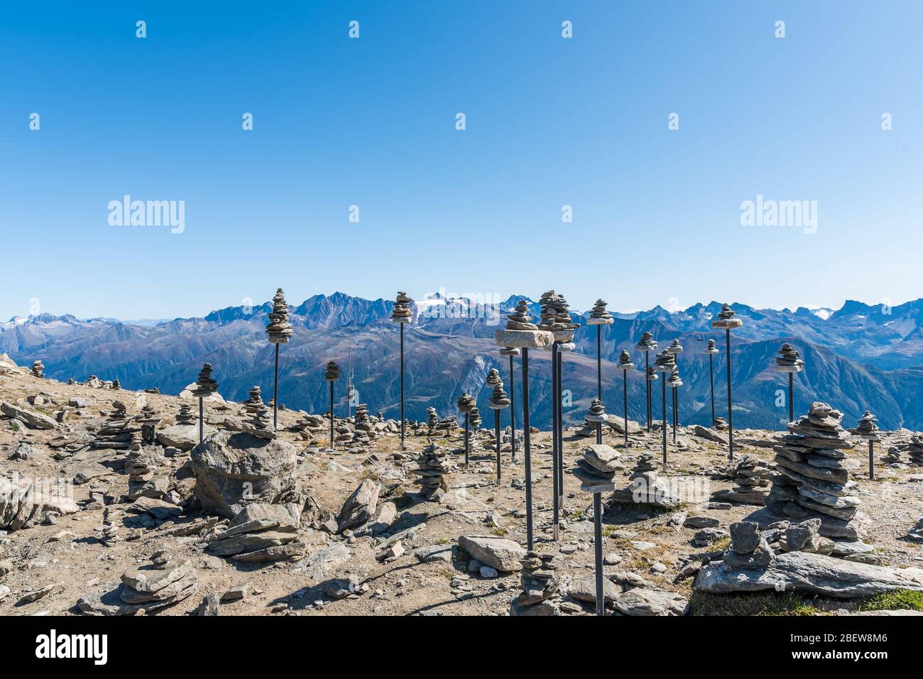 Stone pyramids on a stick. Eggishorn terrace, place of energy and power ...