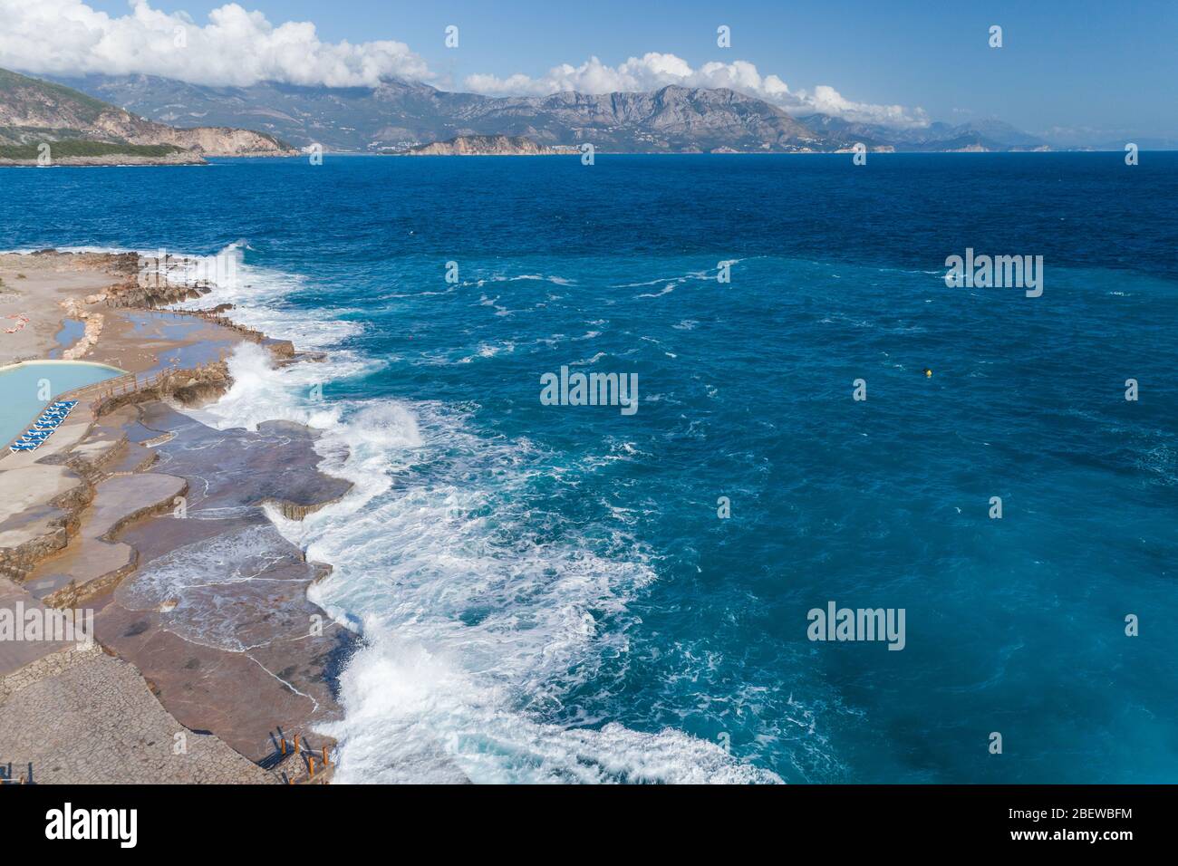Aerial view of Ploce beach and storm waves on the Montenegrin coast ...