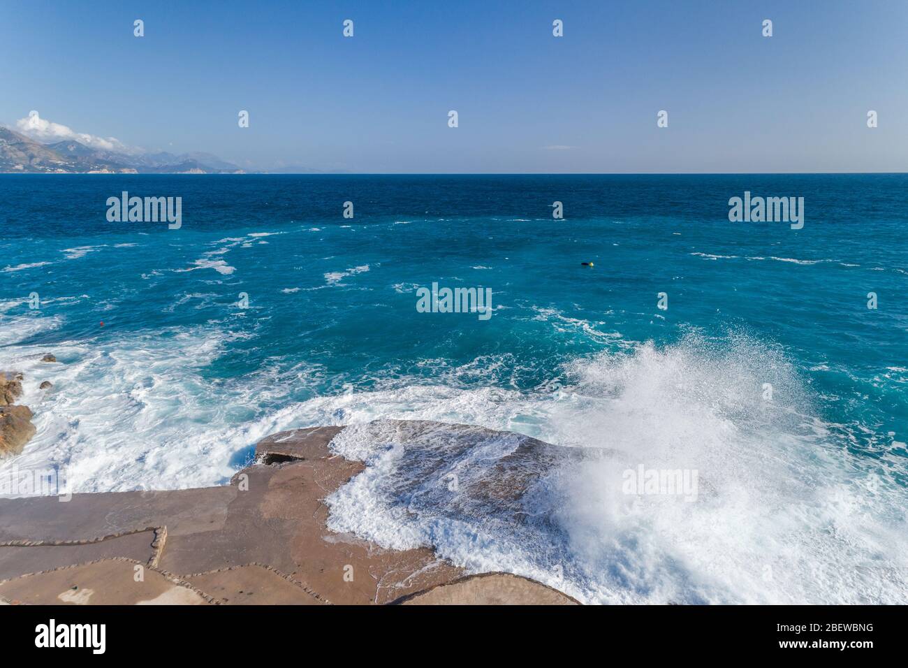 Aerial view of Ploce beach and storm waves on the Montenegrin coast ...