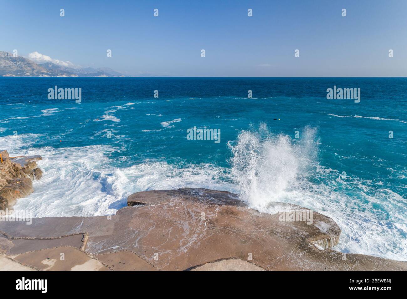 Aerial view of Ploce beach and storm waves on the Montenegrin coast ...