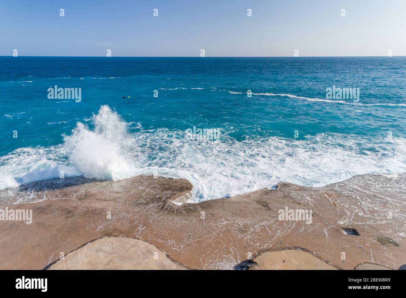 Aerial view of Ploce beach and storm waves on the Montenegrin coast ...