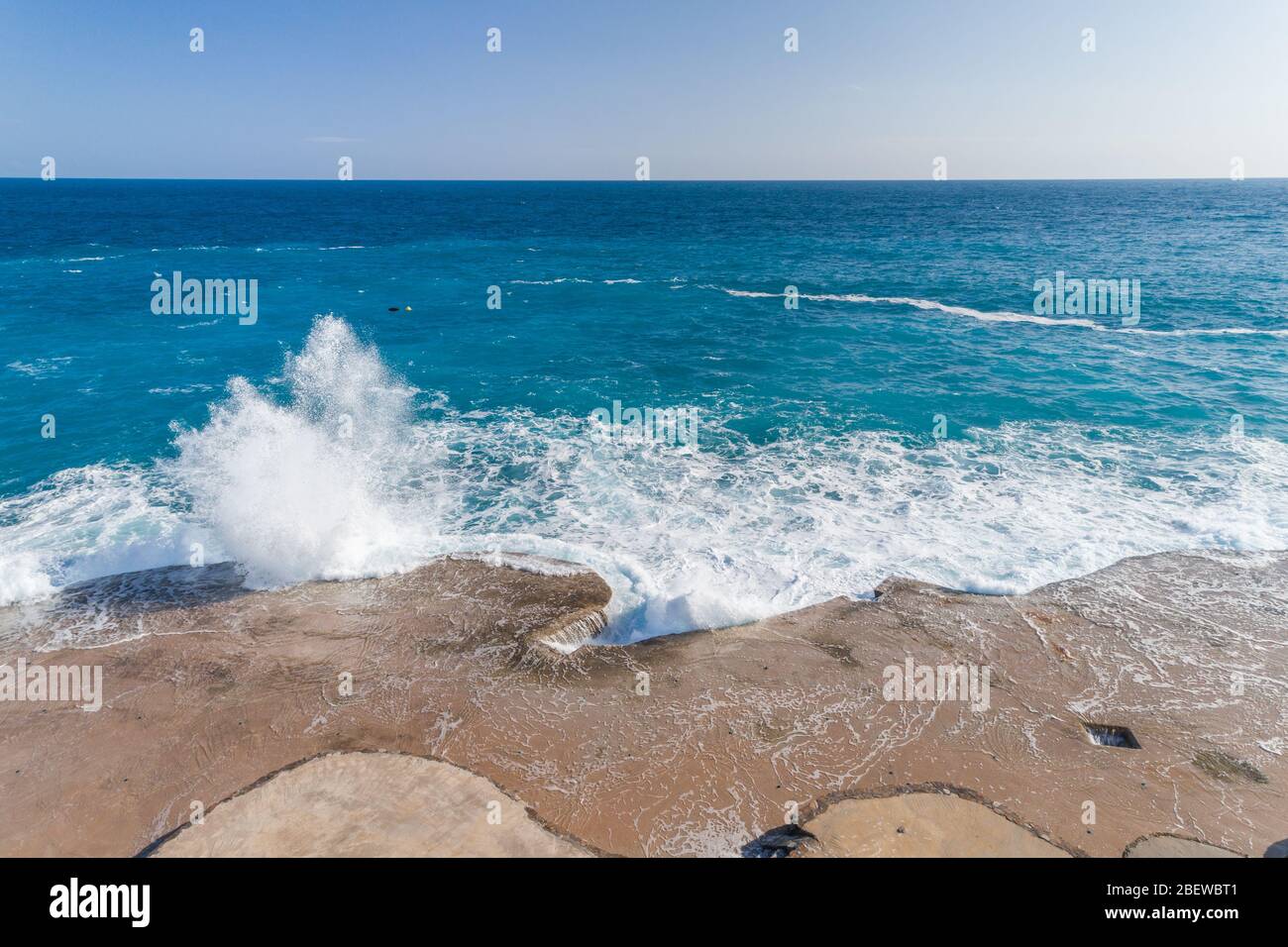 Aerial view of Ploce beach and storm waves on the Montenegrin coast ...