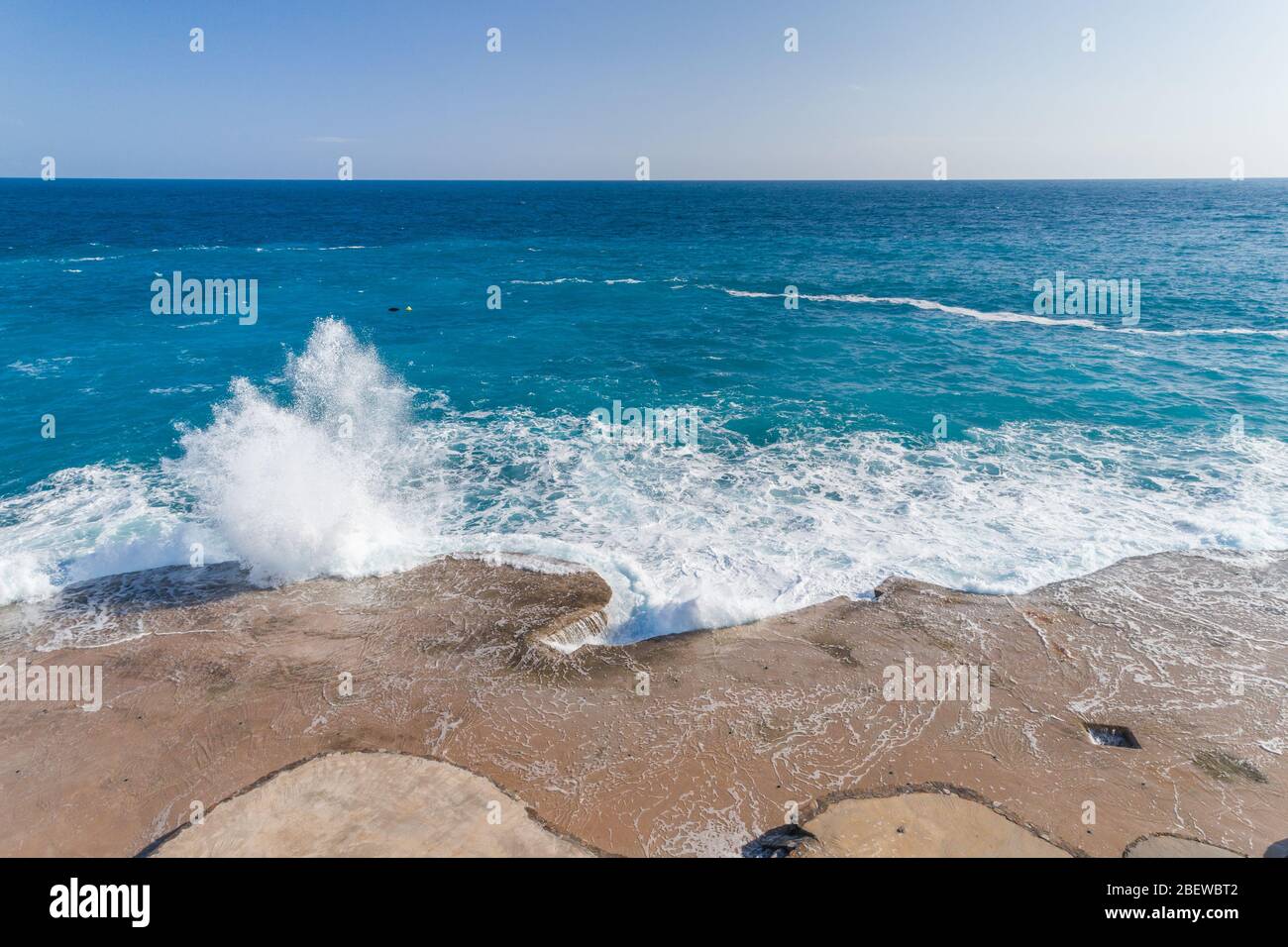Aerial view of Ploce beach and storm waves on the Montenegrin coast ...