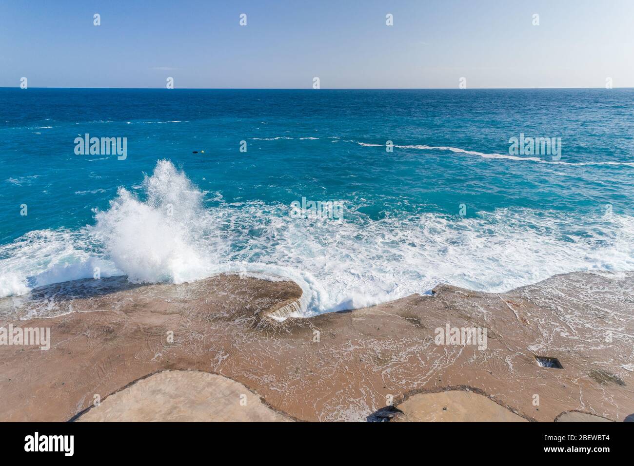 Aerial view of Ploce beach and storm waves on the Montenegrin coast ...