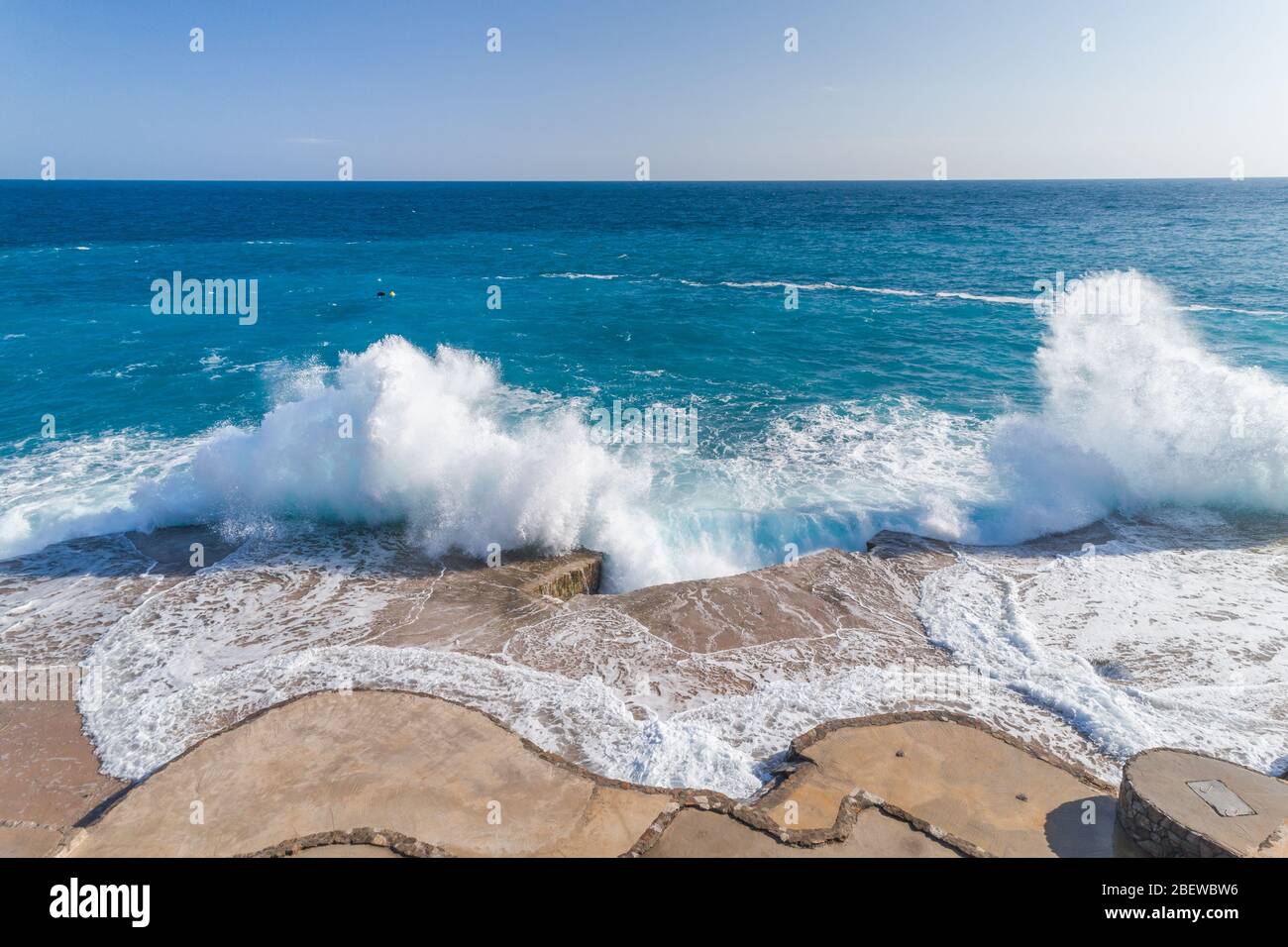 Aerial view of Ploce beach and storm waves on the Montenegrin coast ...