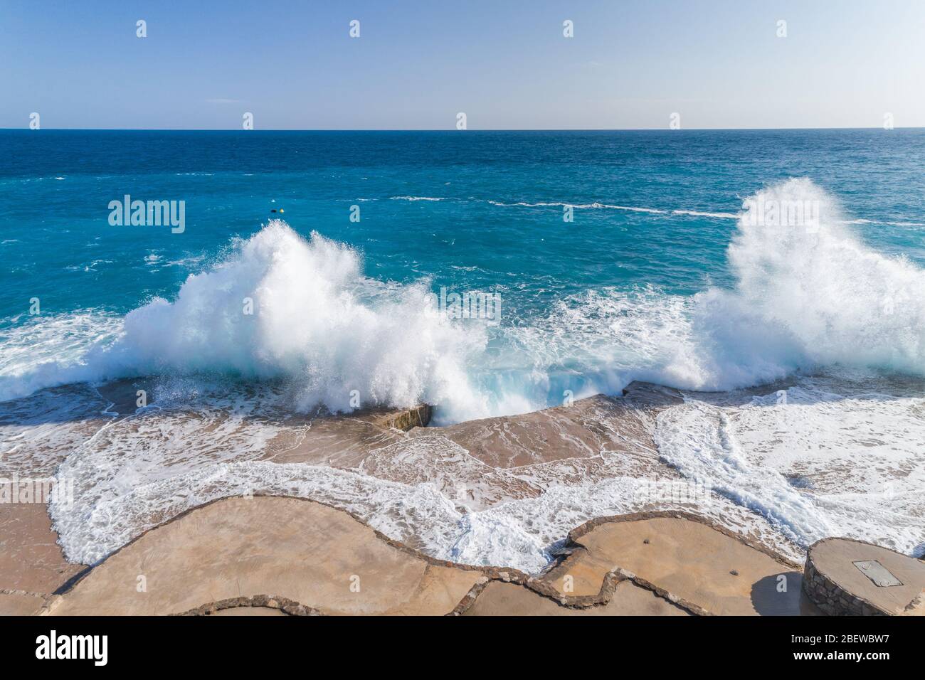 Aerial view of Ploce beach and storm waves on the Montenegrin coast ...