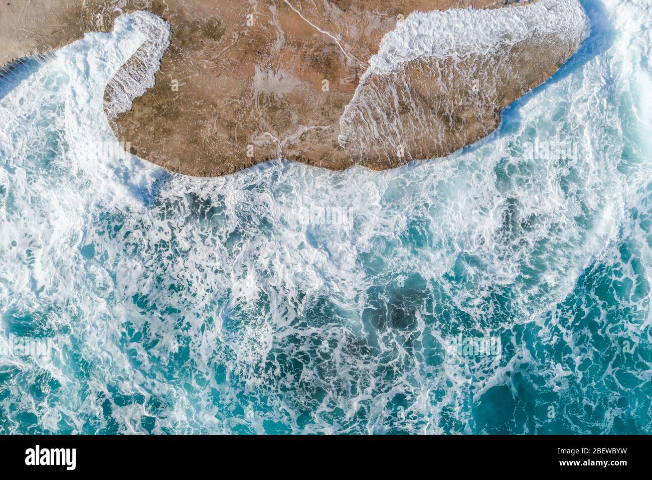 Aerial view of Ploce beach and storm waves on the Montenegrin coast ...