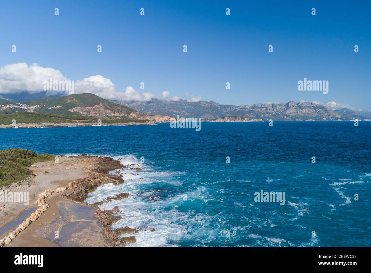 Aerial view of Ploce beach and storm waves on the Montenegrin coast ...