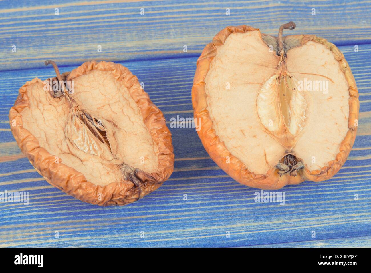 Old wrinkled moldy apple on board, concept of unhealthy and disgusting ...