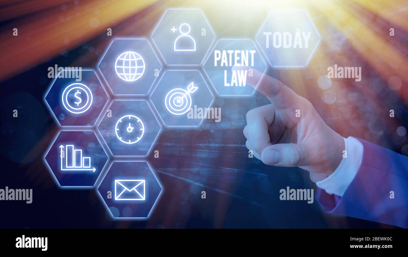 Writing note showing Patent Law. Business concept for deals with an ...