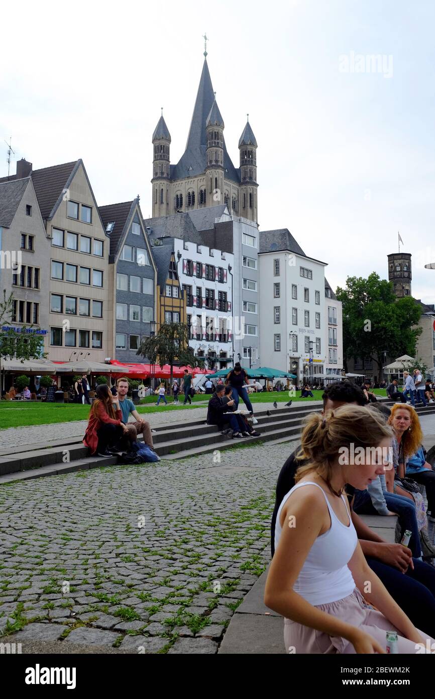 People gathering relaxing in the waterfront of River Rhine with old ...