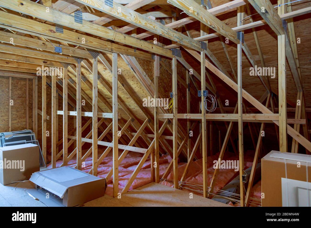 Foam plastic insulation installed in the sloping attic of a new frame ...