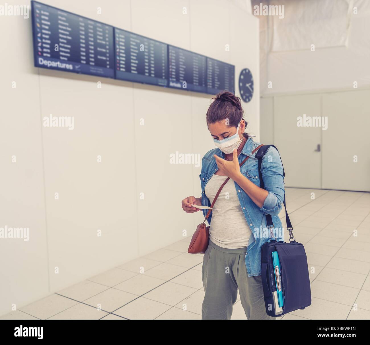 COVID-19 worldwide borders closures.Traveler with face mask stuck in ...