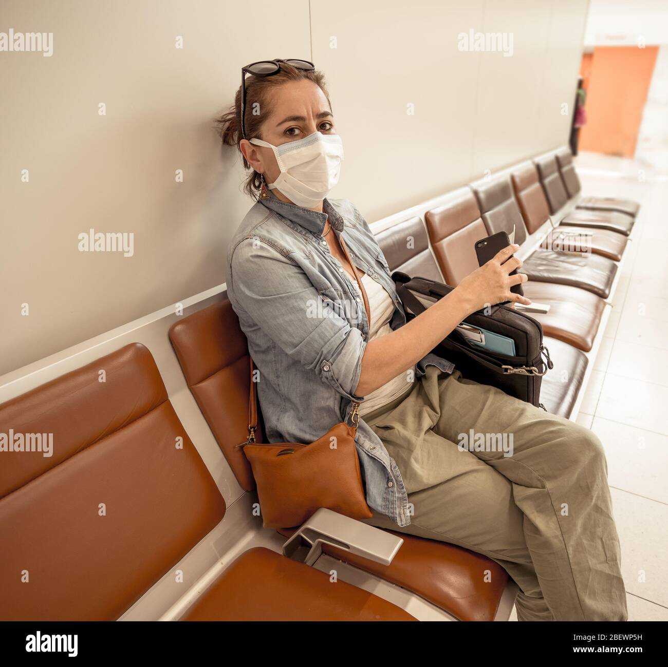 COVID-19 worldwide borders closures.Traveler with face mask stuck in ...