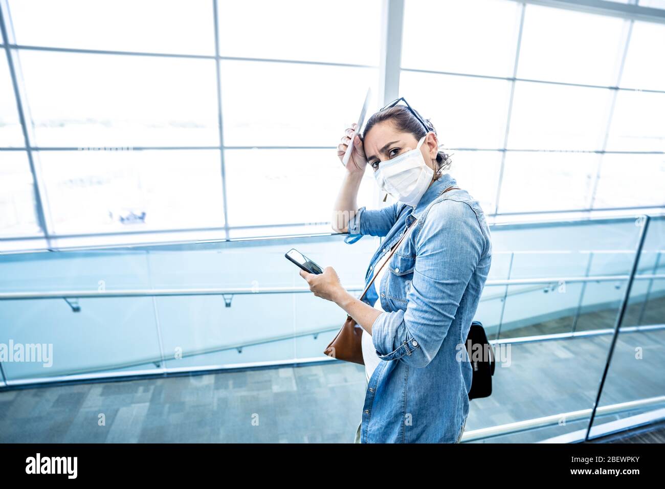 COVID-19 worldwide borders closures.Traveler with face mask stuck in ...