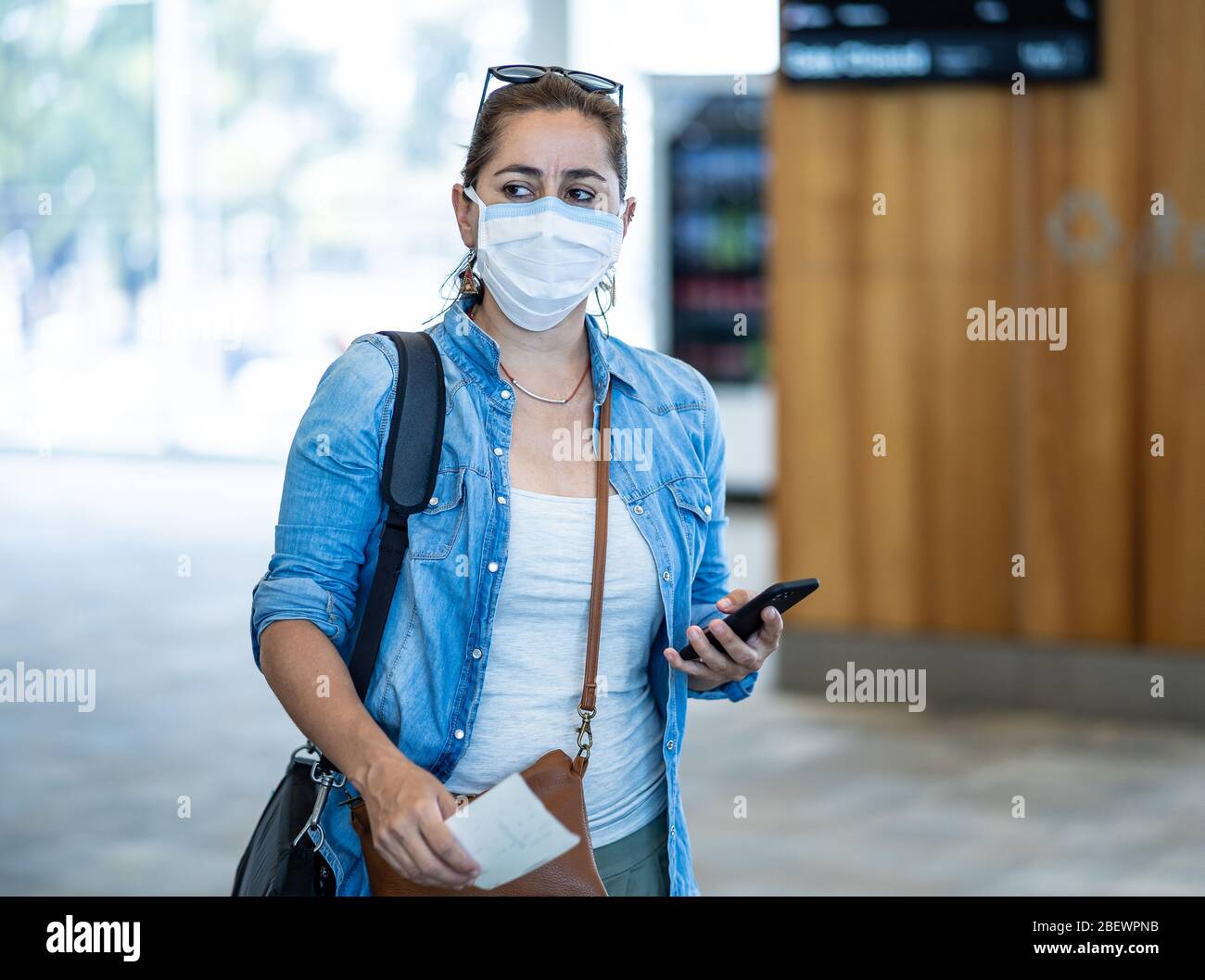 COVID-19 worldwide borders closures.Traveler with face mask stuck in ...