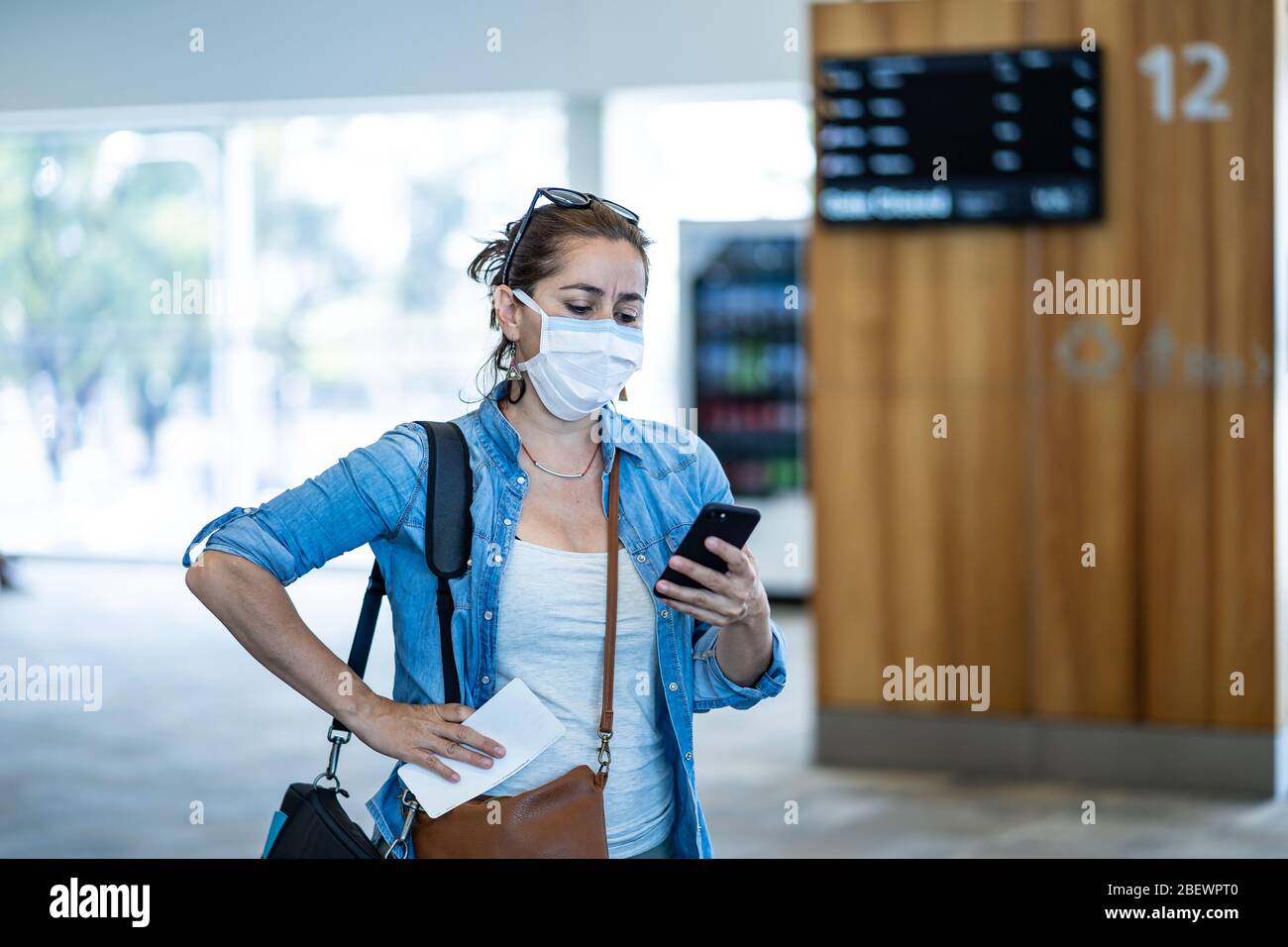 COVID-19 worldwide borders closures.Traveler with face mask stuck in ...