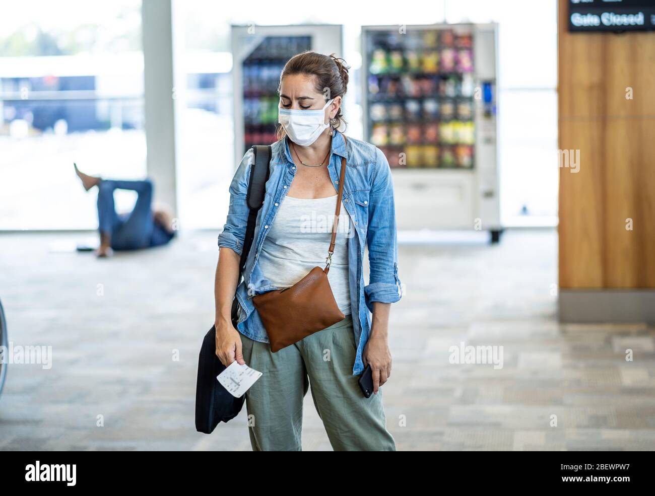 COVID-19 worldwide borders closures.Traveler with face mask stuck in ...