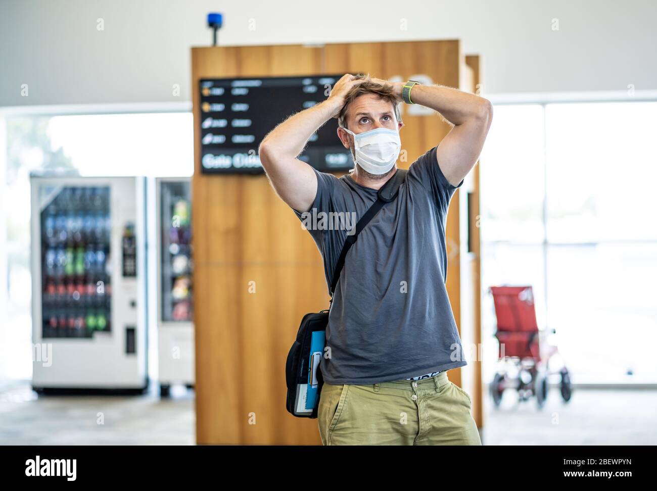 COVID-19 worldwide borders closures.Traveler with face mask stuck in ...