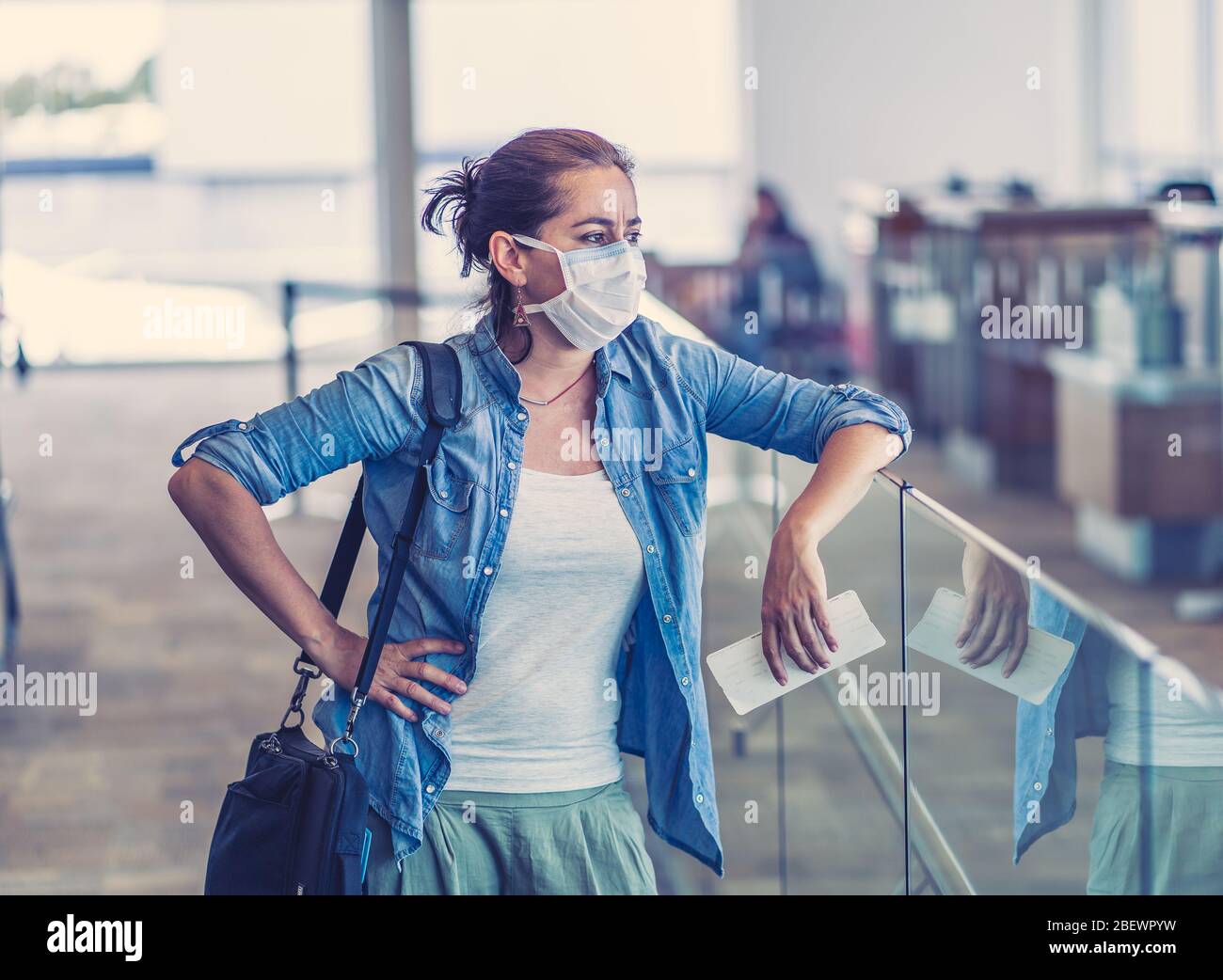COVID-19 worldwide borders closures.Traveler with face mask stuck in ...