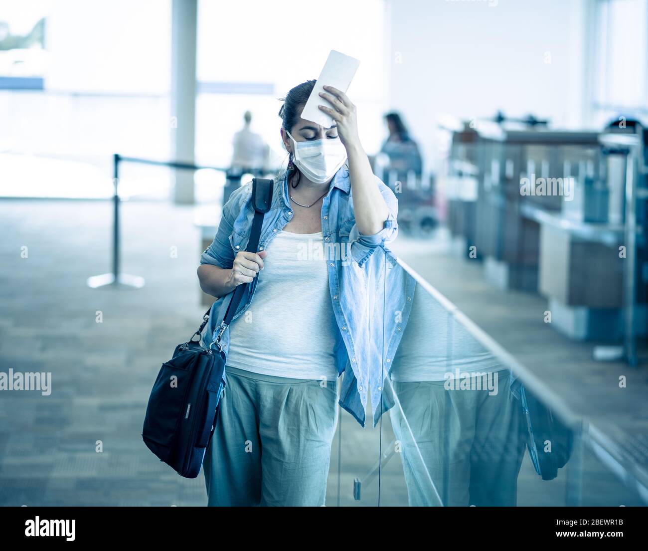 COVID-19 worldwide borders closures.Traveler with face mask stuck in ...