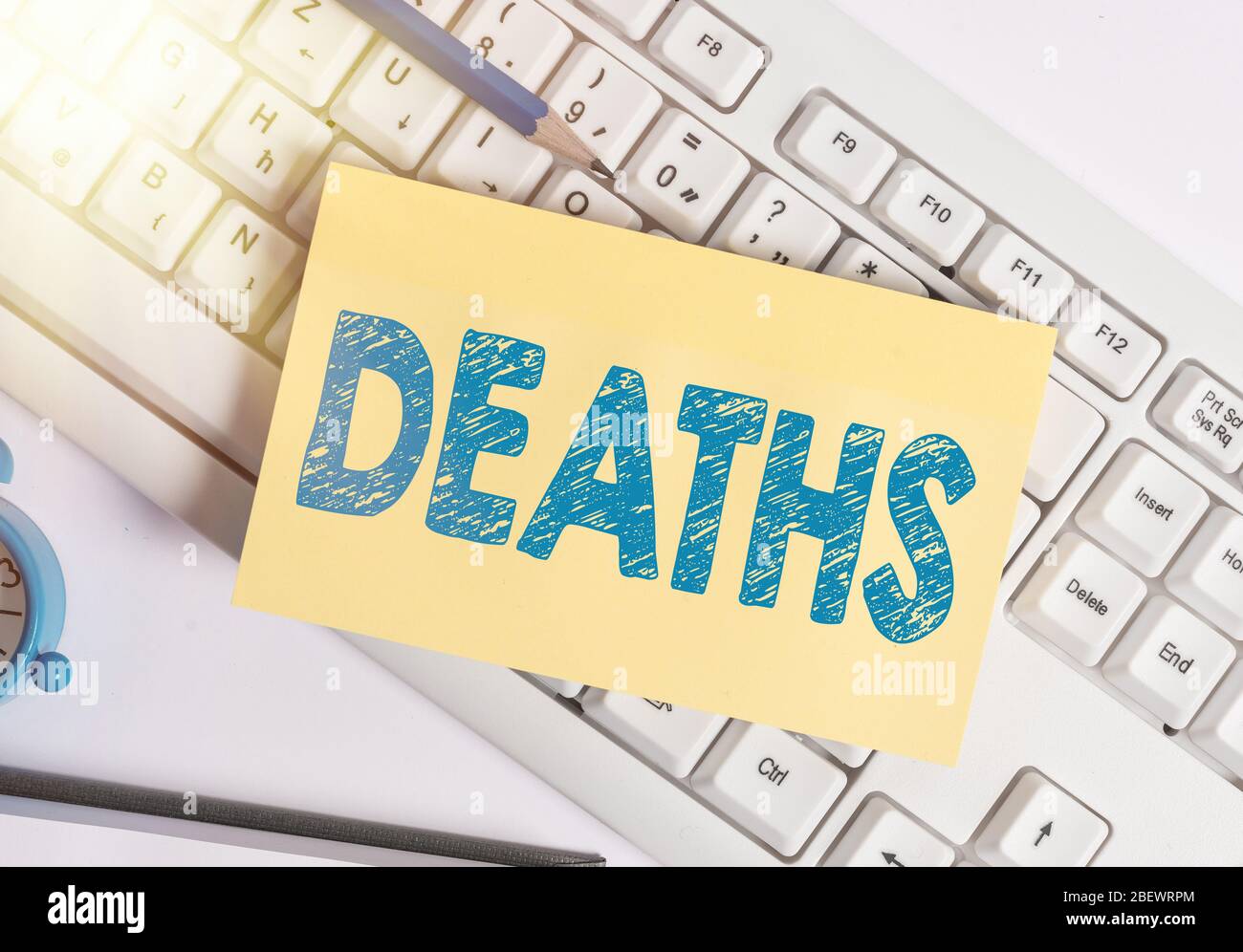 Writing note showing Deaths. Business concept for permanent cessation ...