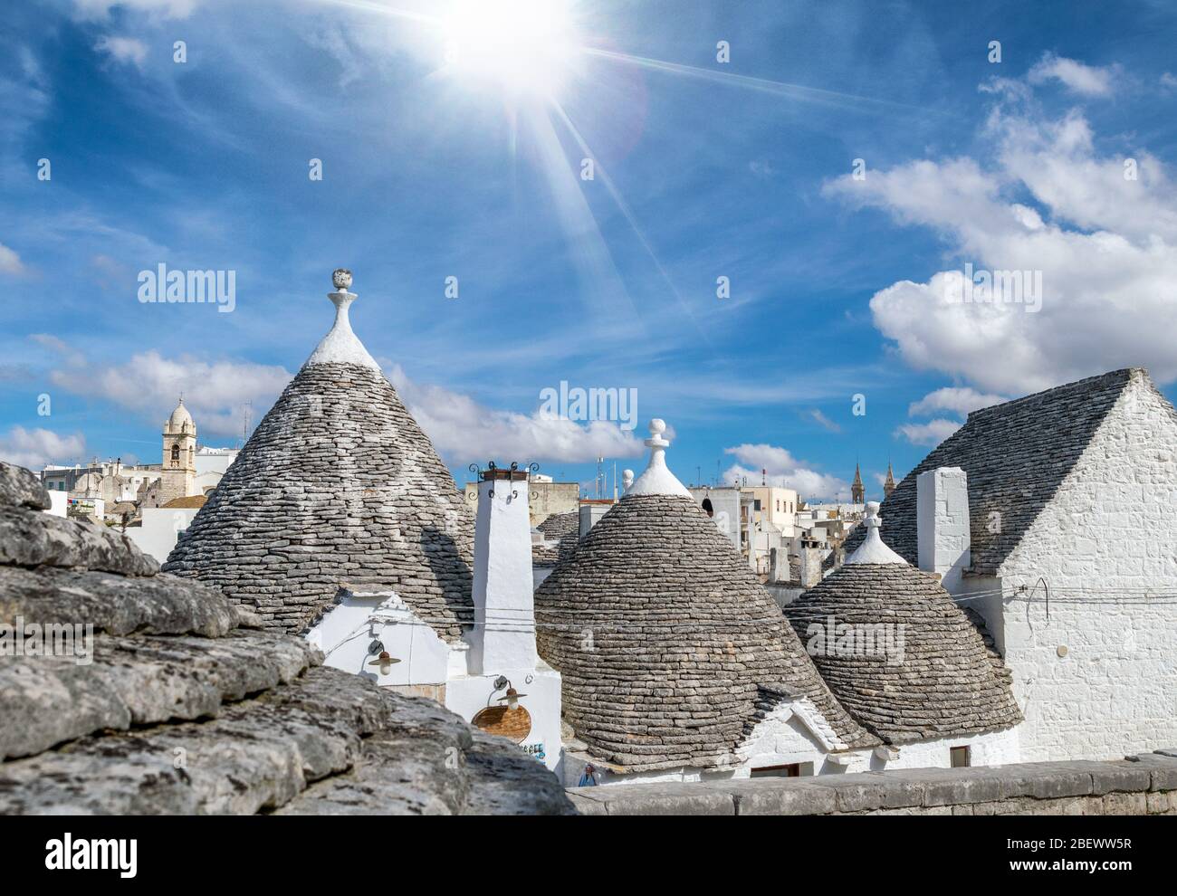 Alberobello panoramic aerial view on a wonderful sunny day with sun ...