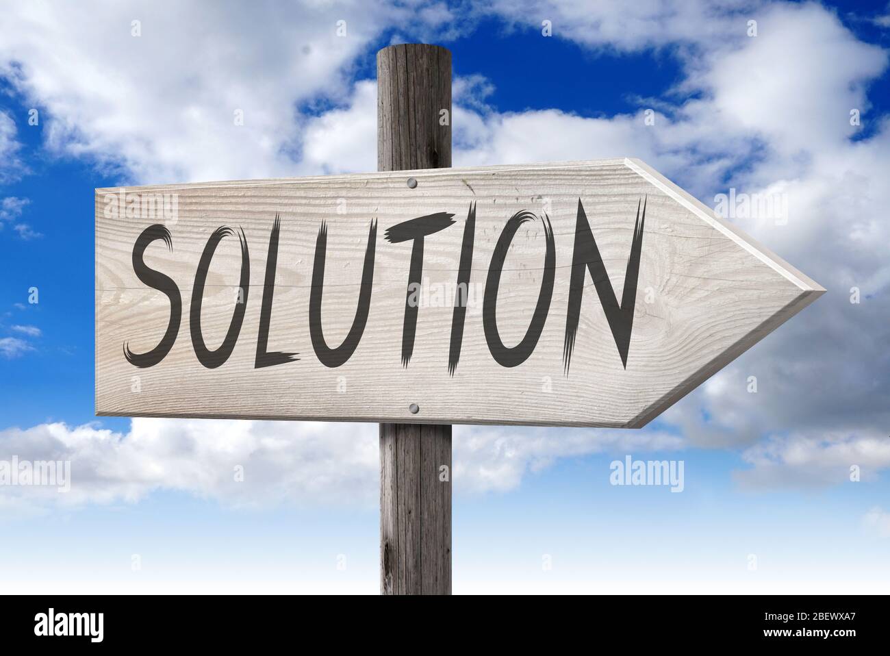Solution - wooden signpost with one arrow Stock Photo - Alamy
