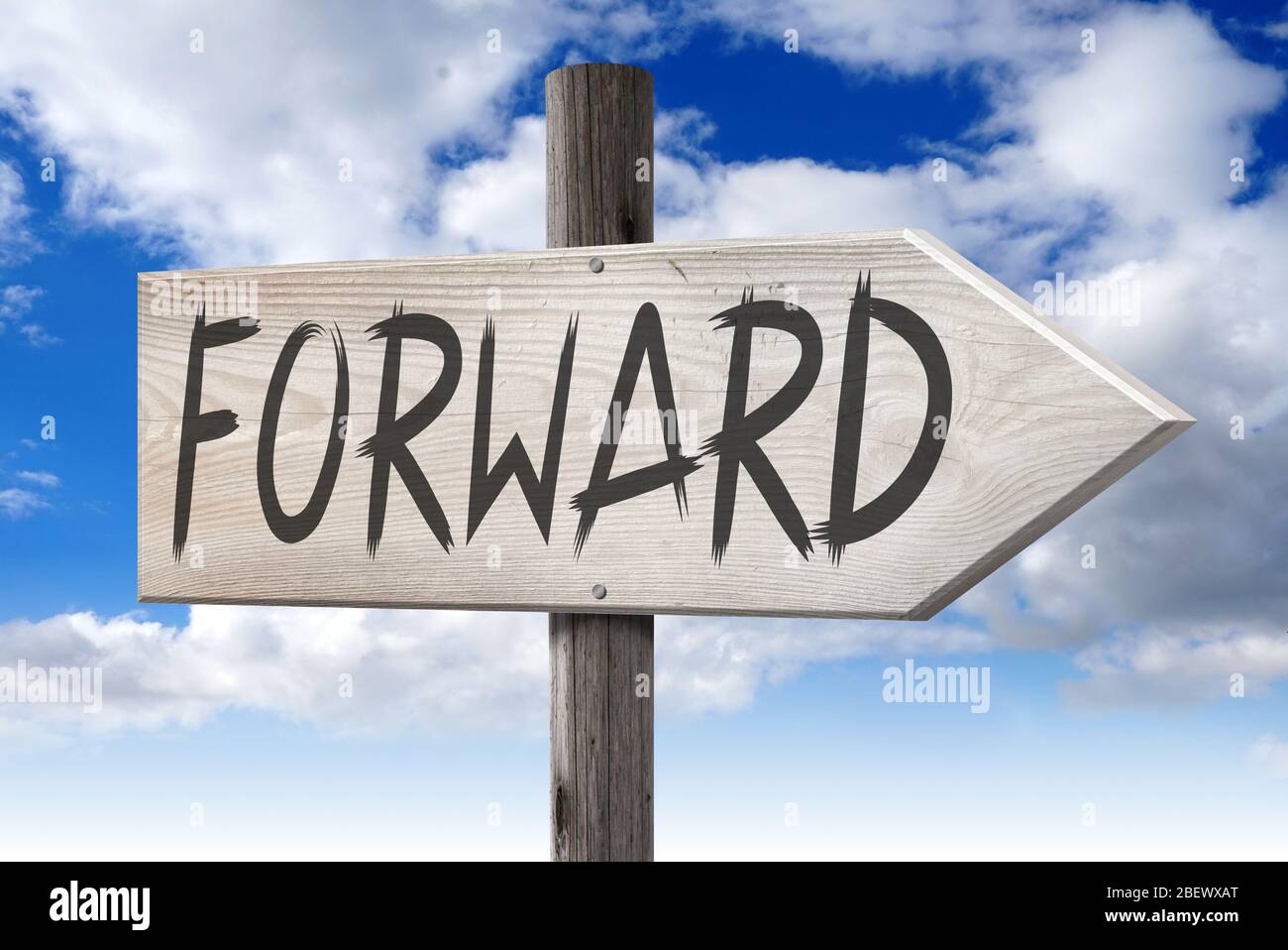 Forward - wooden signpost with one arrow Stock Photo - Alamy