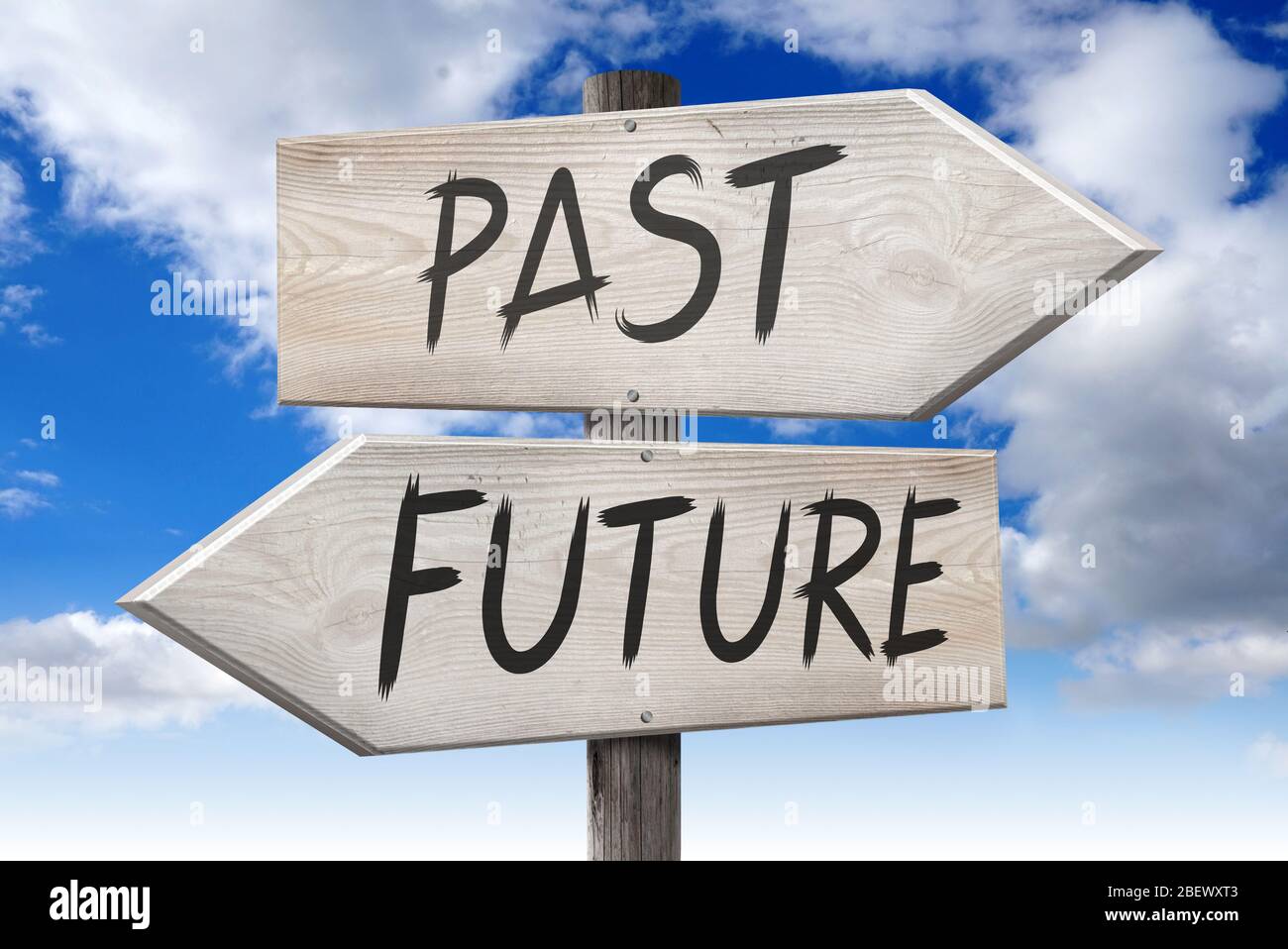 Wooden signpost with two arrows Stock Photo - Alamy