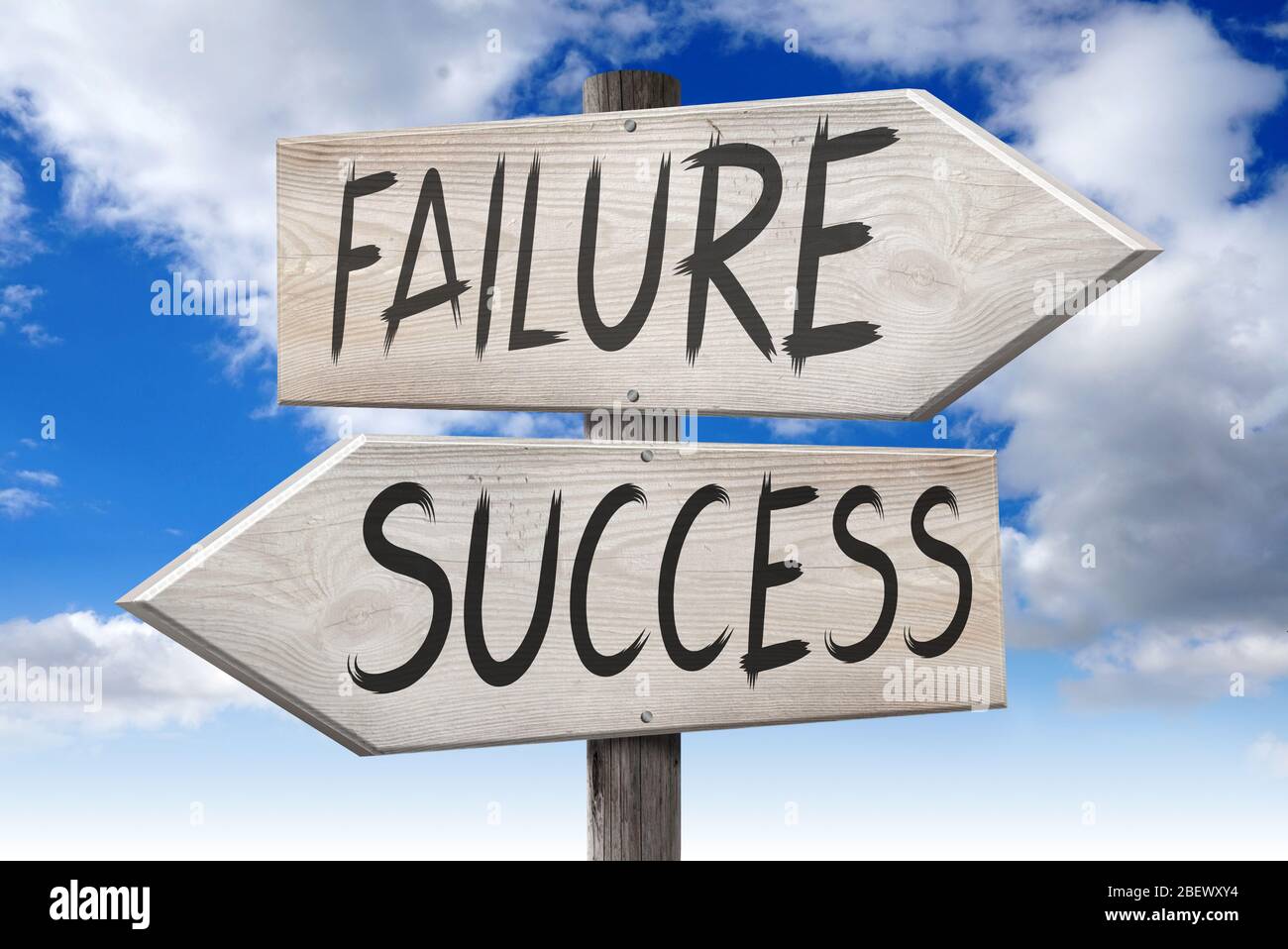 Wooden signpost with two arrows Stock Photo - Alamy