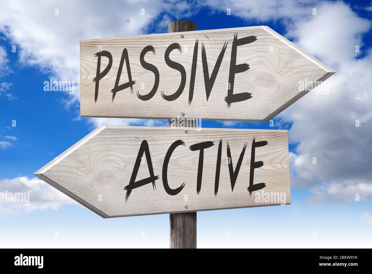 Wooden signpost with two arrows Stock Photo - Alamy