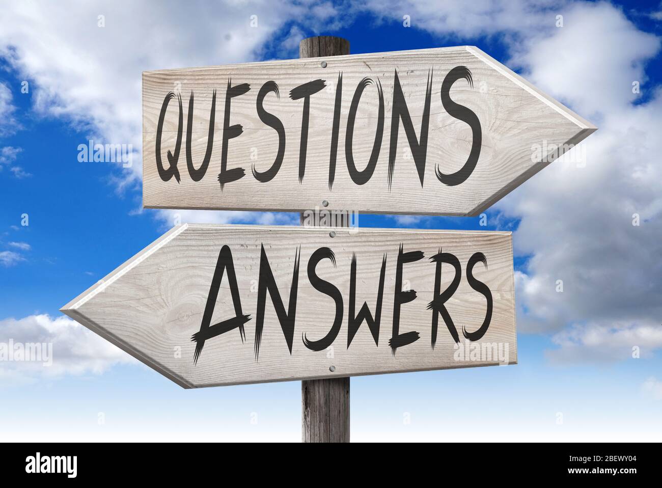 Wooden signpost with two arrows Stock Photo - Alamy