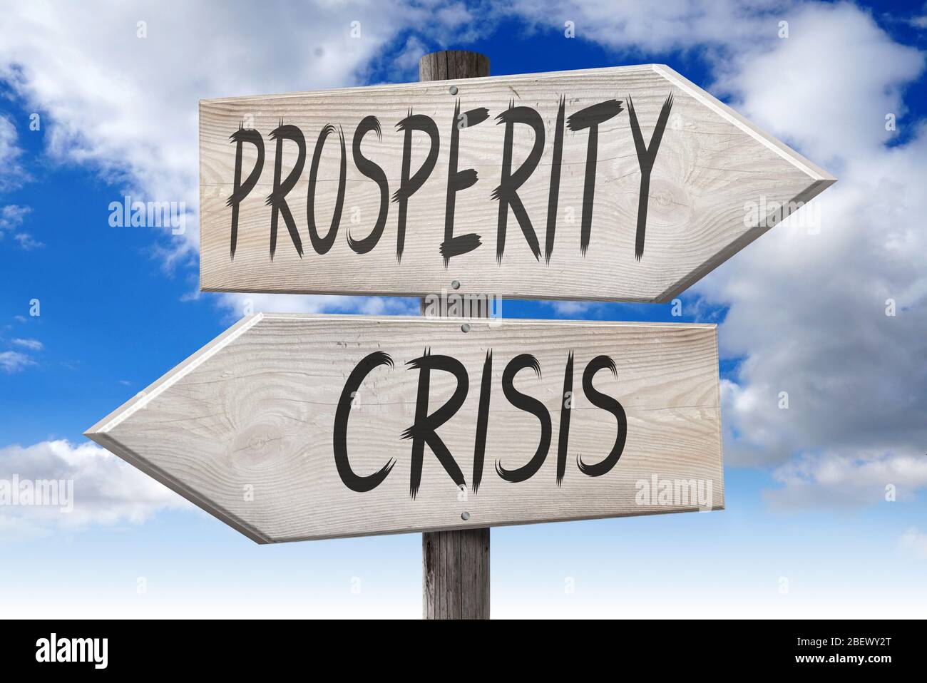 Wooden signpost with two arrows Stock Photo - Alamy