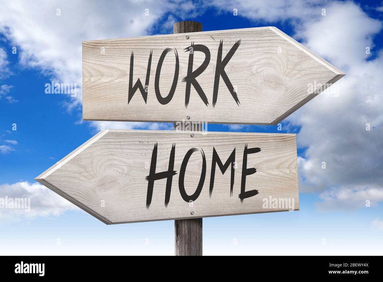 Wooden signpost with two arrows Stock Photo - Alamy