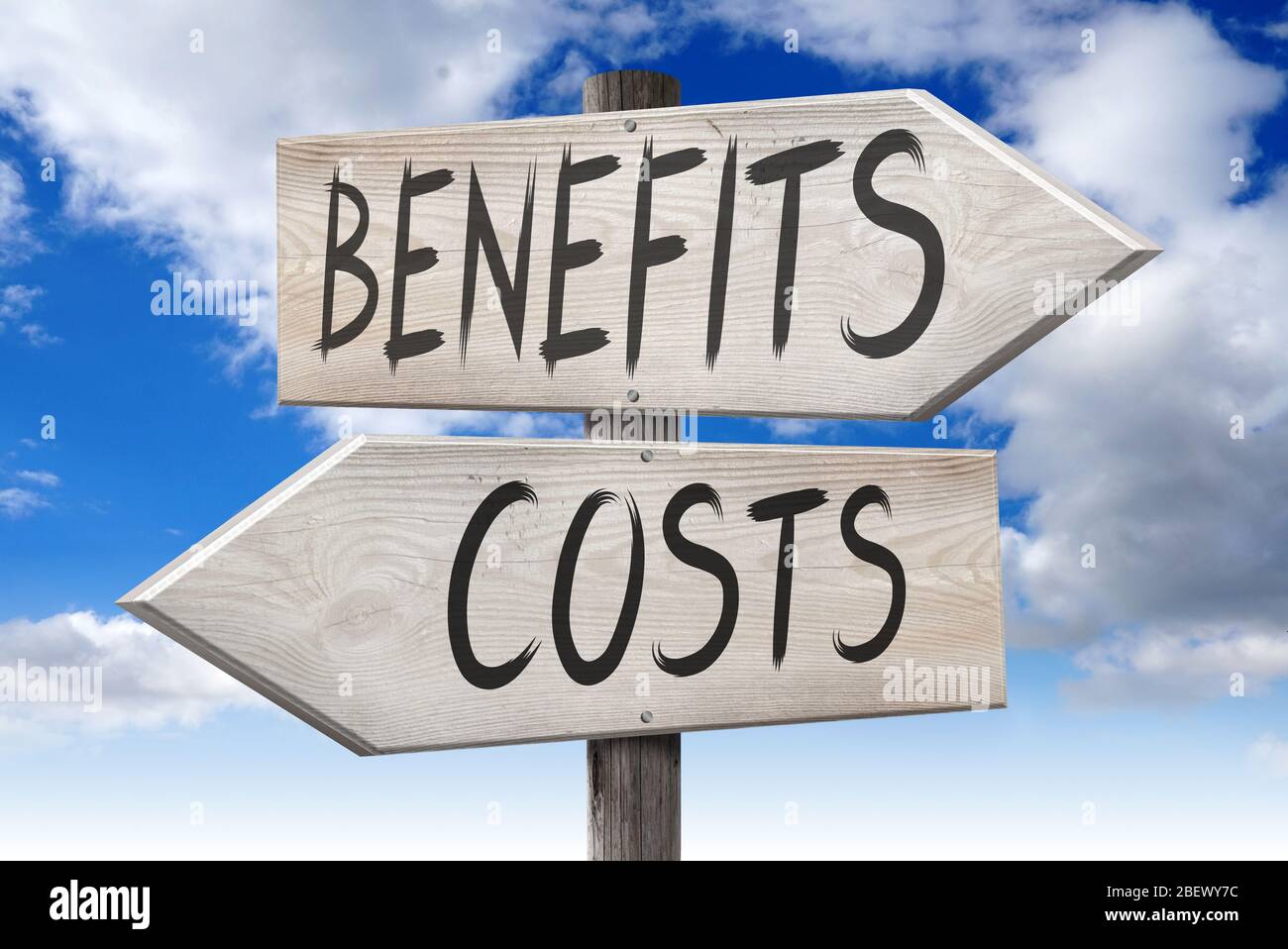 Wooden signpost with two arrows Stock Photo - Alamy