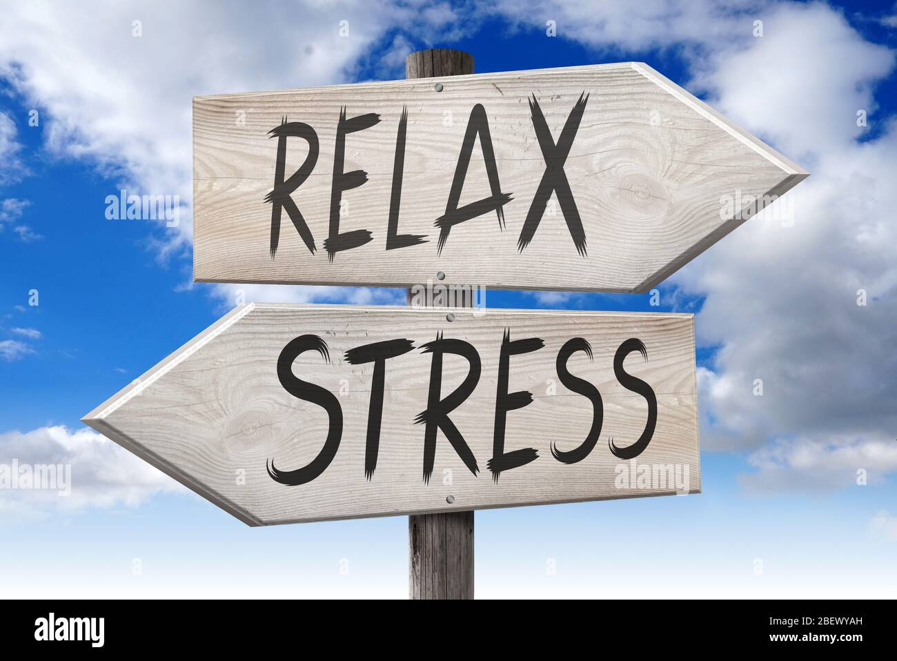 Wooden signpost with two arrows Stock Photo - Alamy