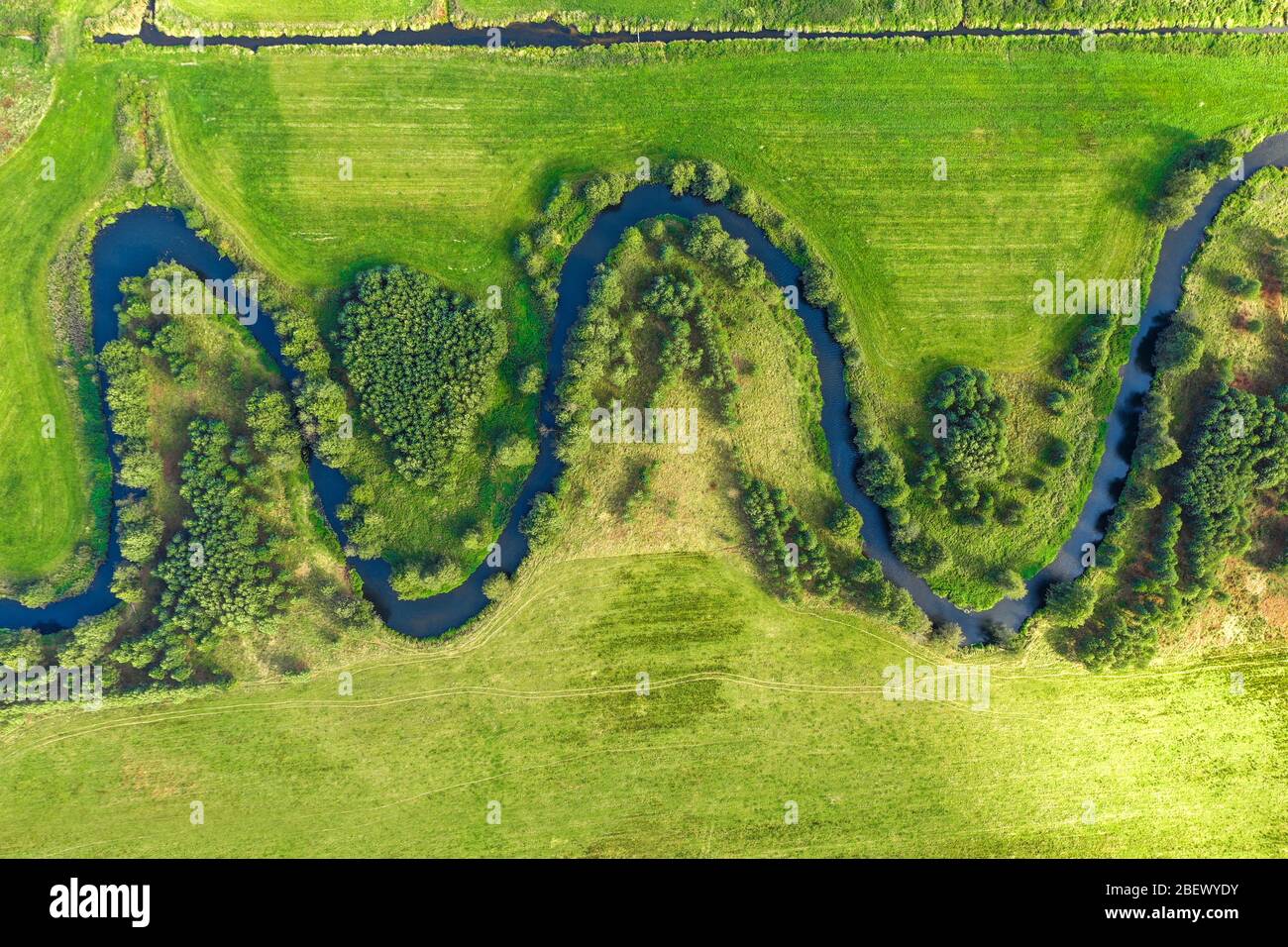 Aerial photograph of winding river in rural landscape. Small river ...