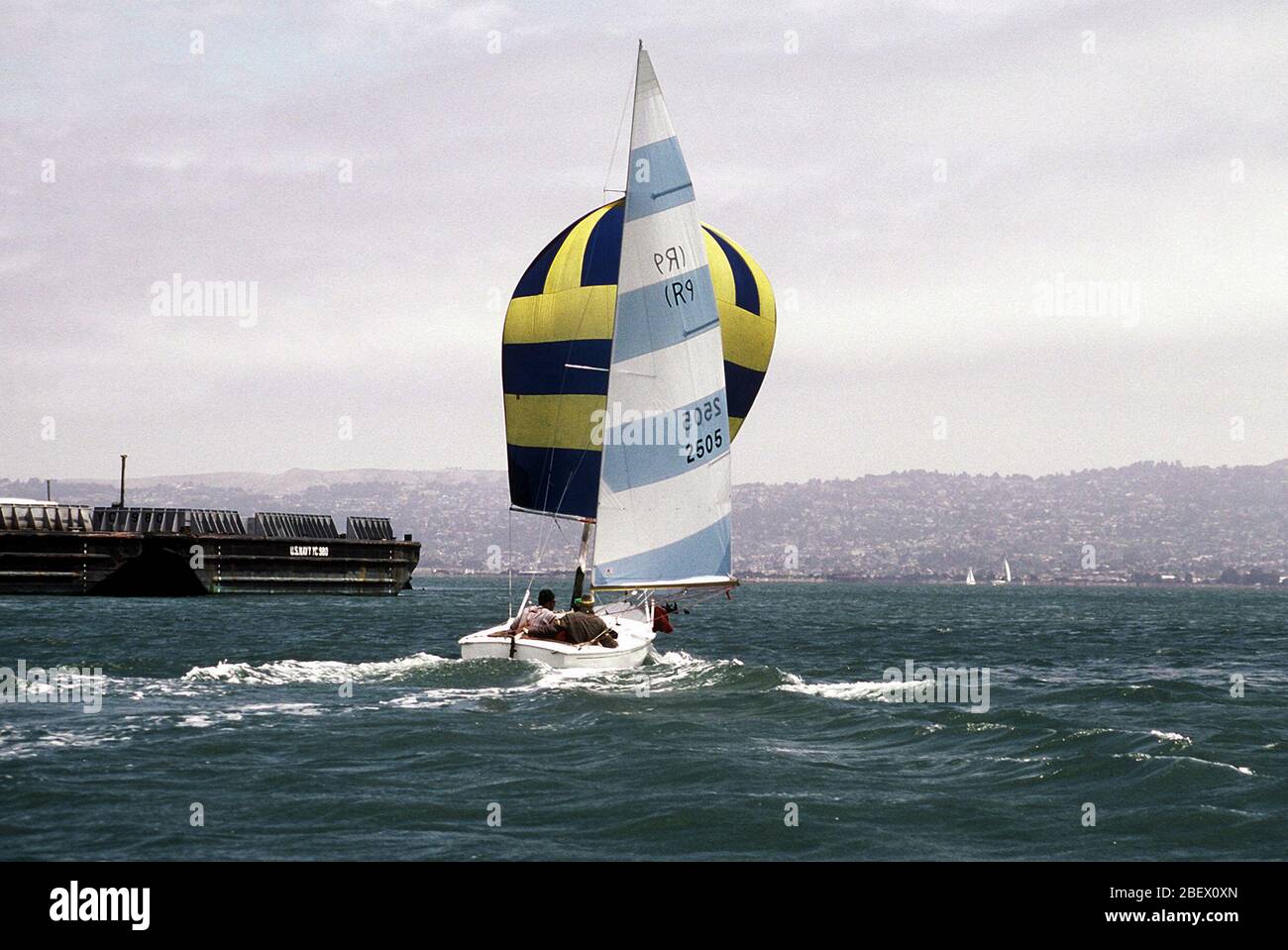 1982 - A sail boat, with spinnaker billowing, takes part in the ...