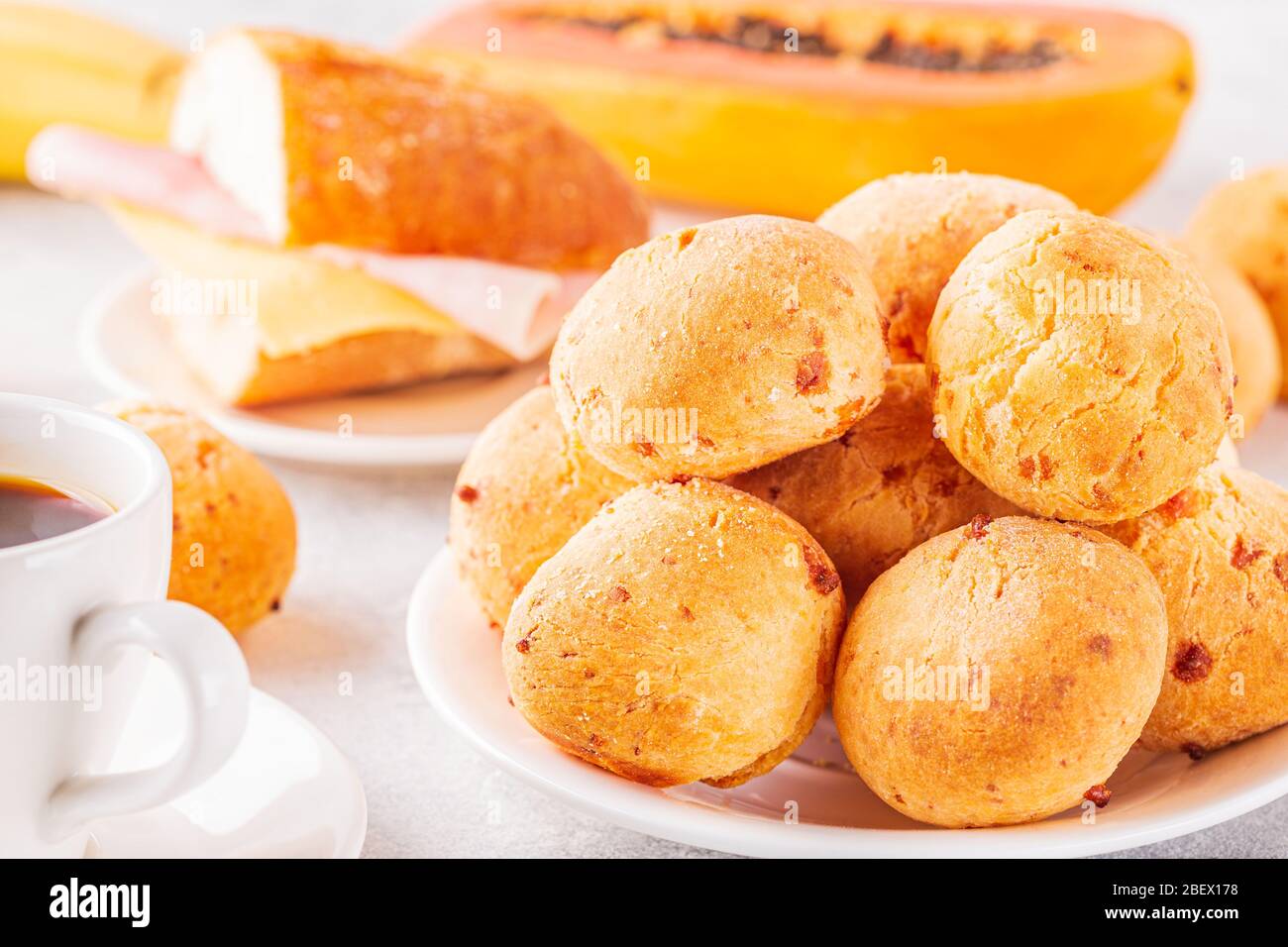 Traditional Brazilian breakfast - cheese bread, coffee, ripe fruit ...