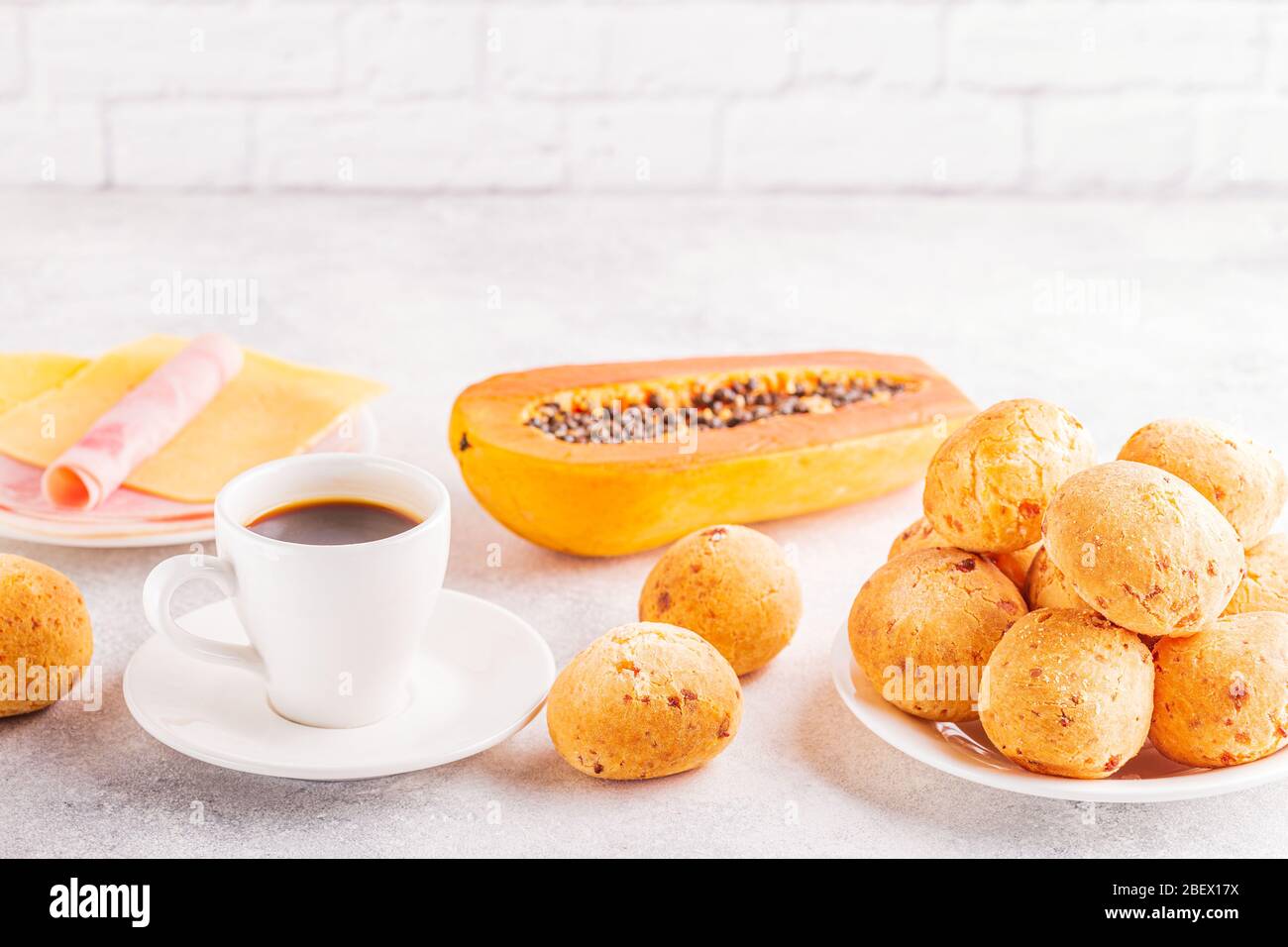 Traditional Brazilian breakfast - cheese bread, coffee, ripe fruit ...