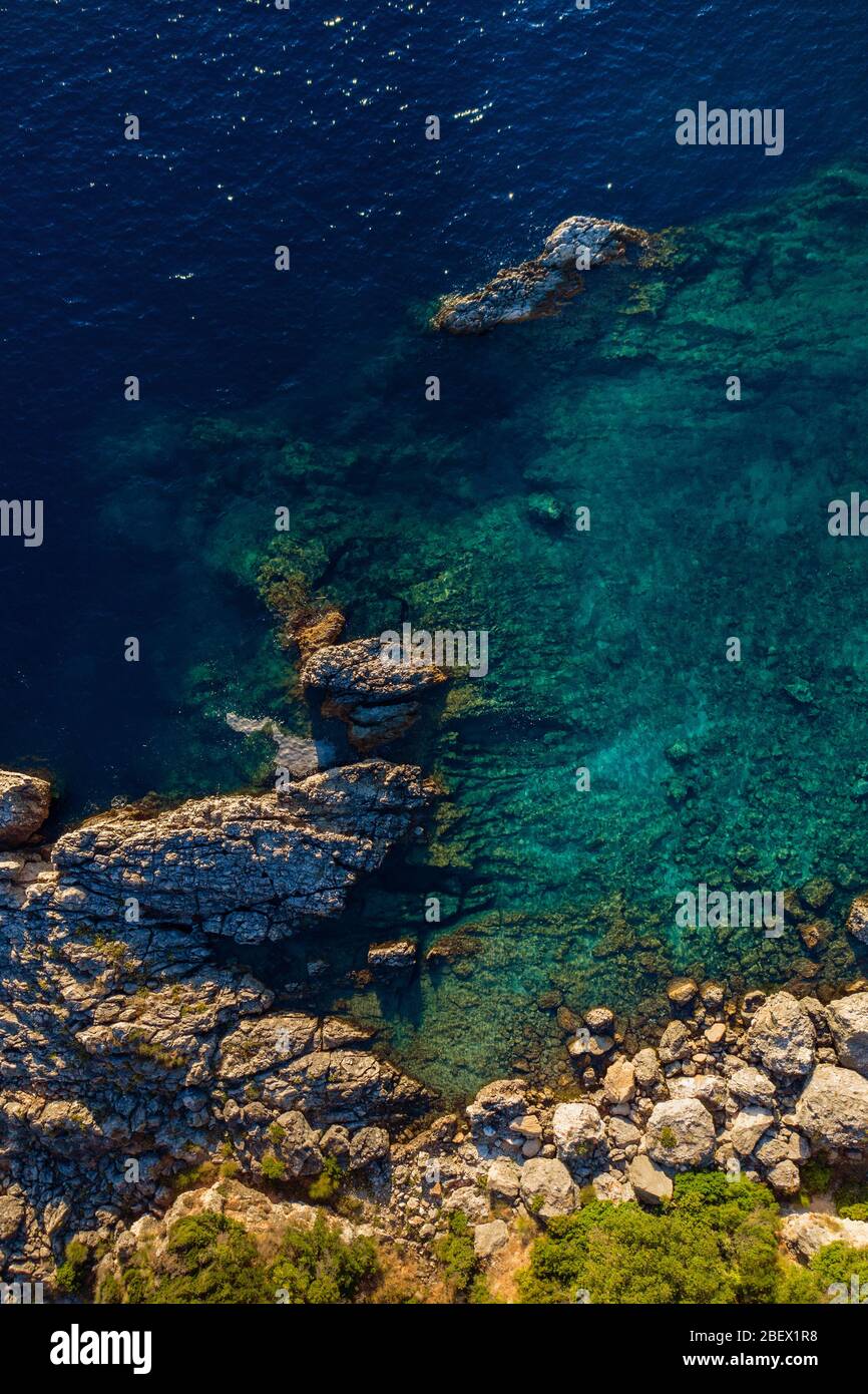 Aerial of a beautiful mediterranean reef. Ridge of jagged rock, coral ...