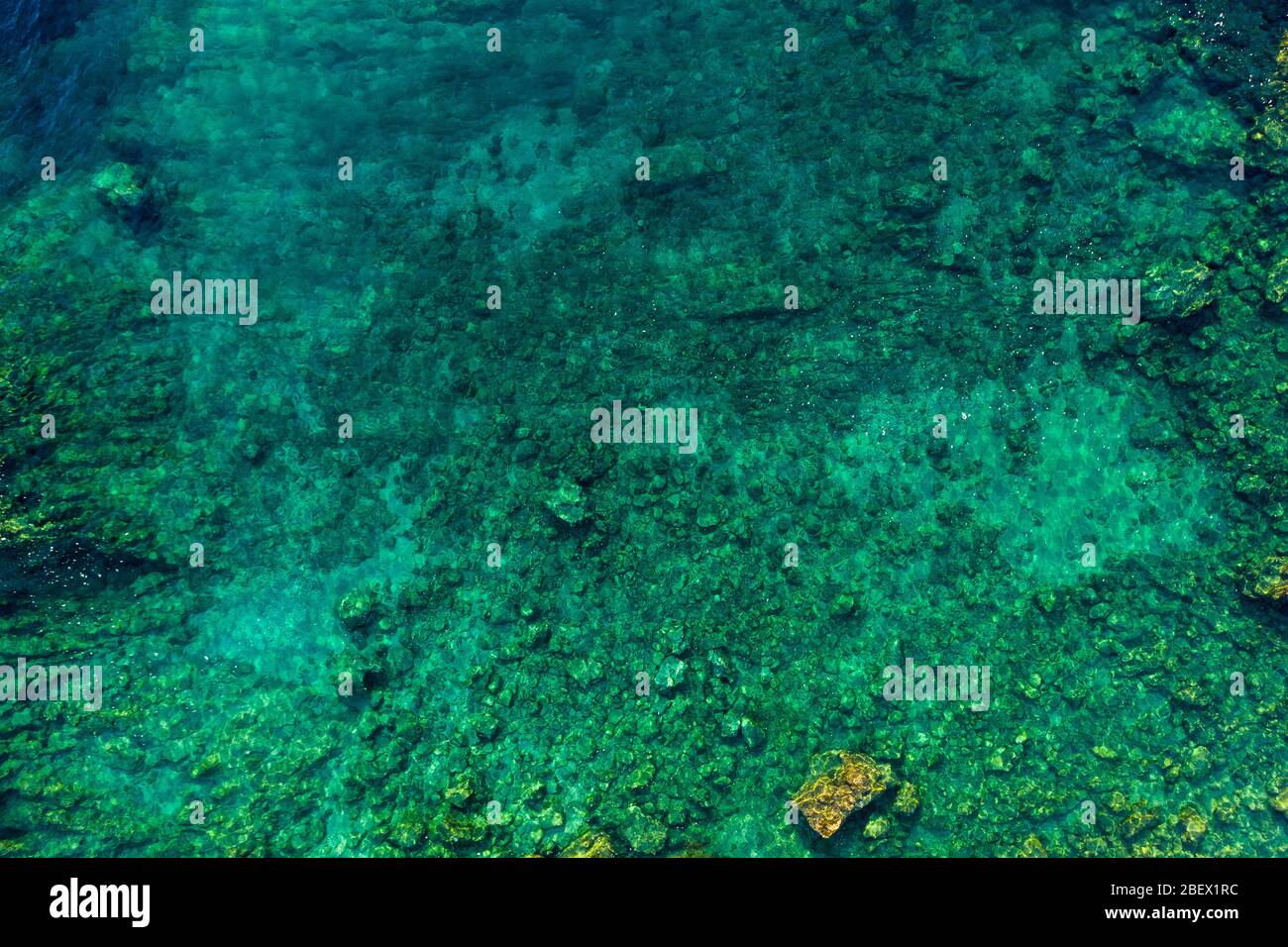 Aerial of ridge of jagged rock on ocean floor. Mediterranean reef ...