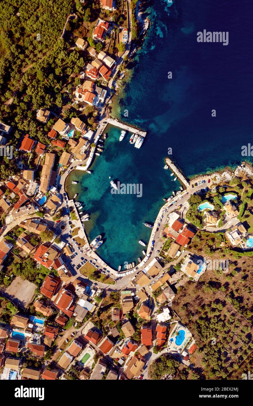 Kassiopi harbour bay on Corfu island aerial. Greek town on a shore of ...