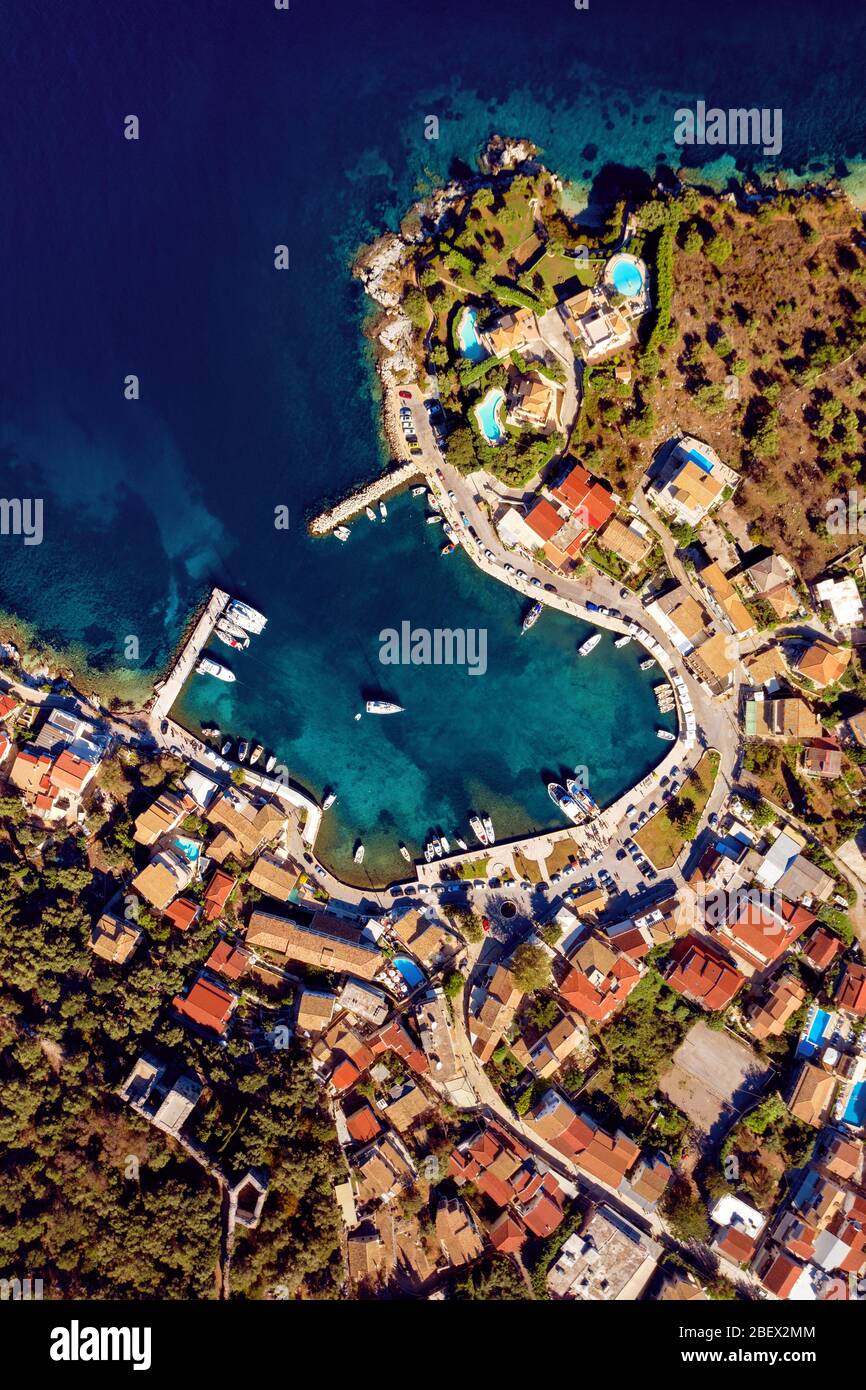 Aerial of a harbour in mediterranean resort Kassiopi. Beautiful bay on ...