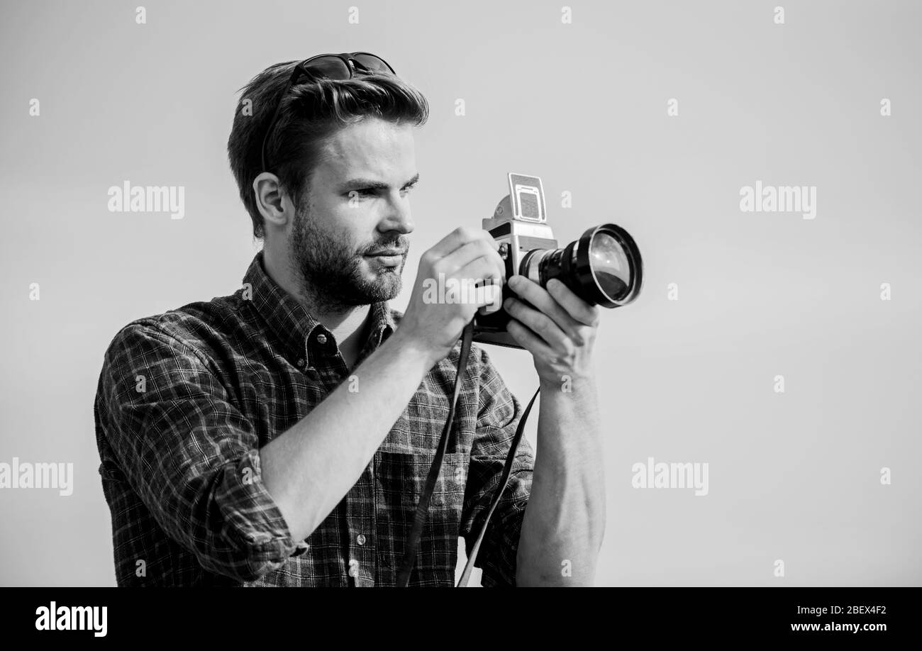 Guy outdoors blue sky background. Photojournalist concept. Travel ...